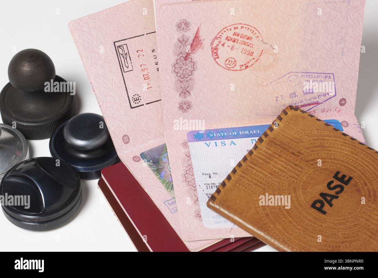 A stack of passports and stamps Stock Photo - Alamy