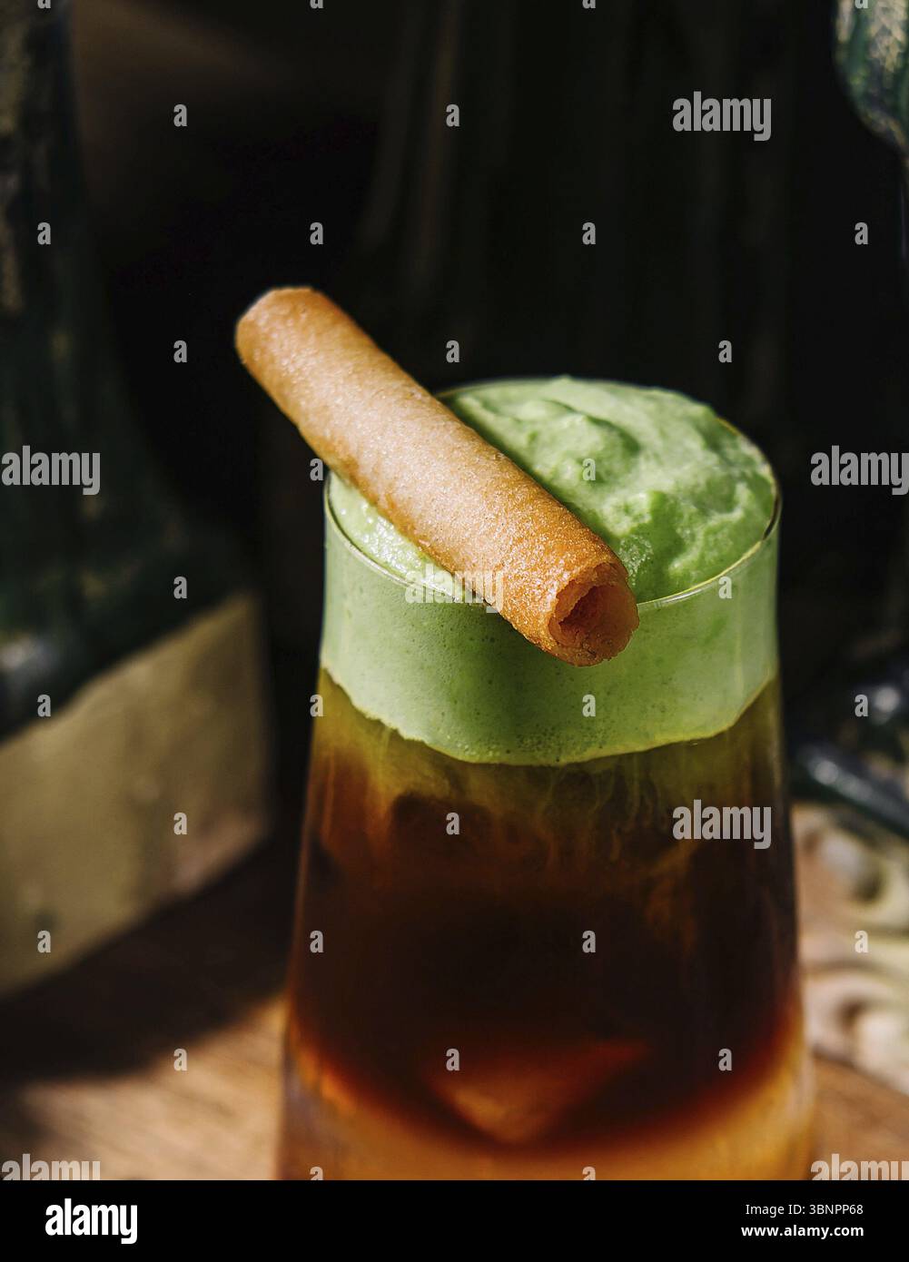 Green layered cocktail on top view Stock Photo - Alamy