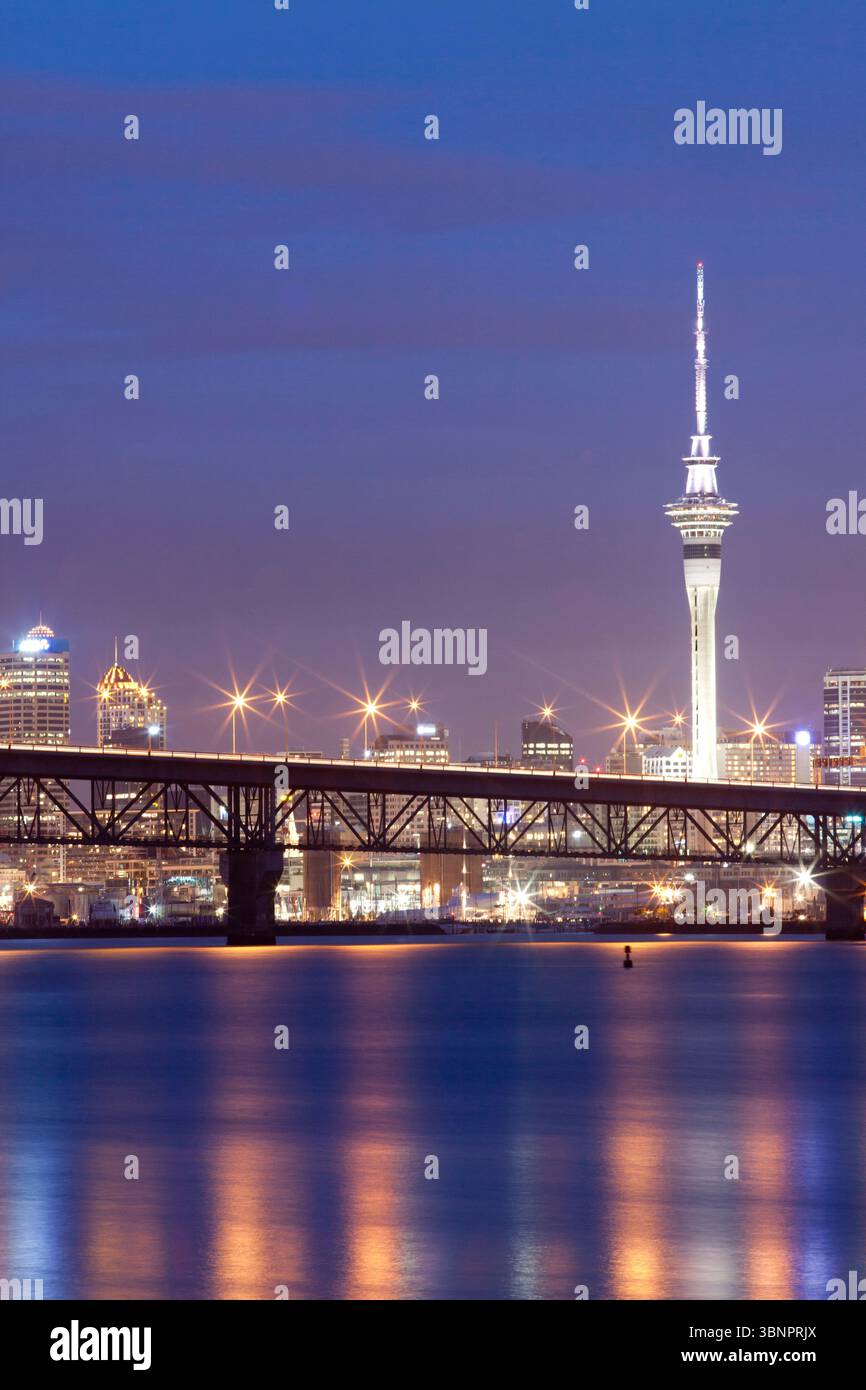 View of the skyline of Auckland behind the Auckland Harbour Bridge ...
