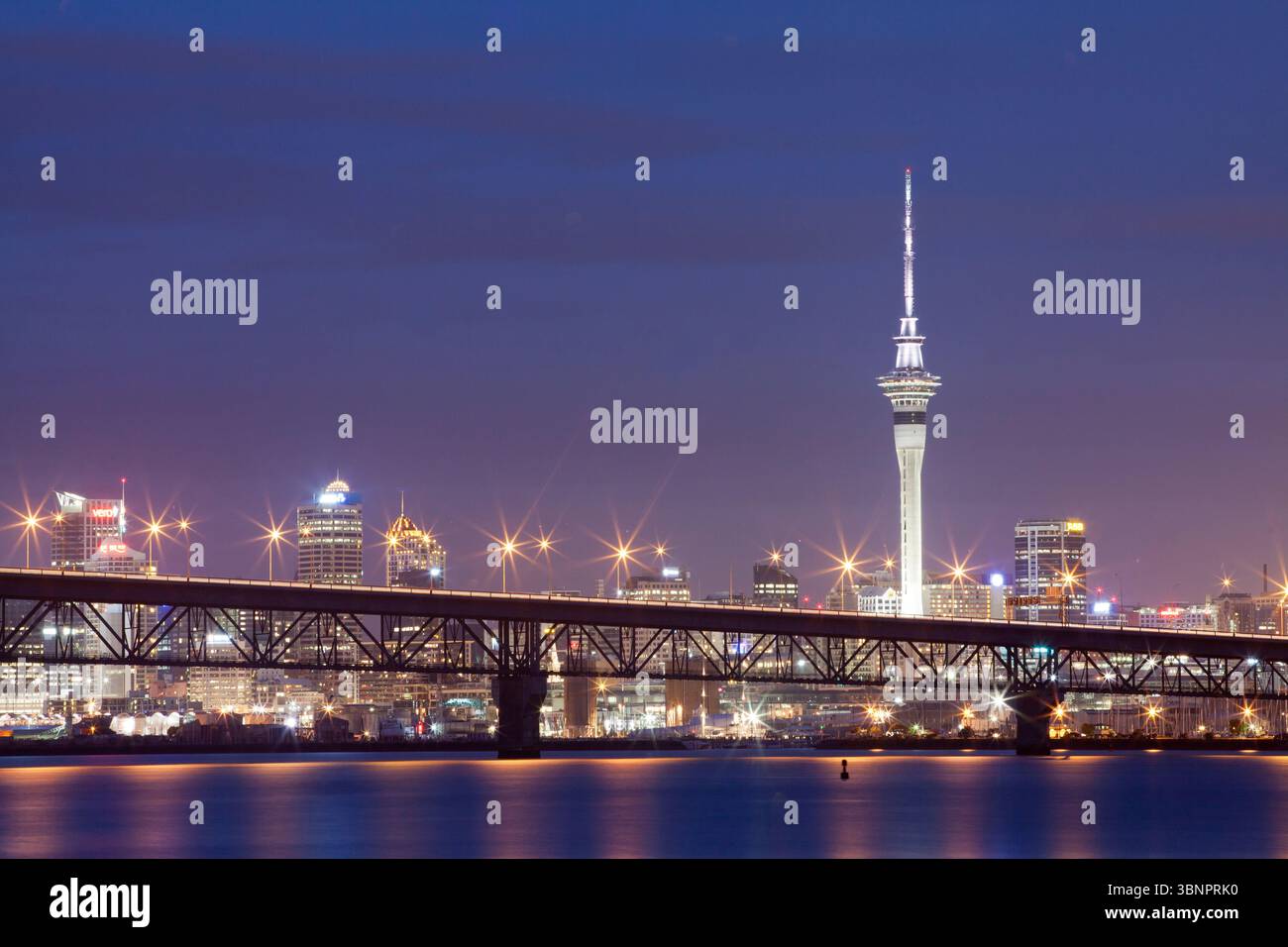 View of the skyline of Auckland behind the Auckland Harbour Bridge ...