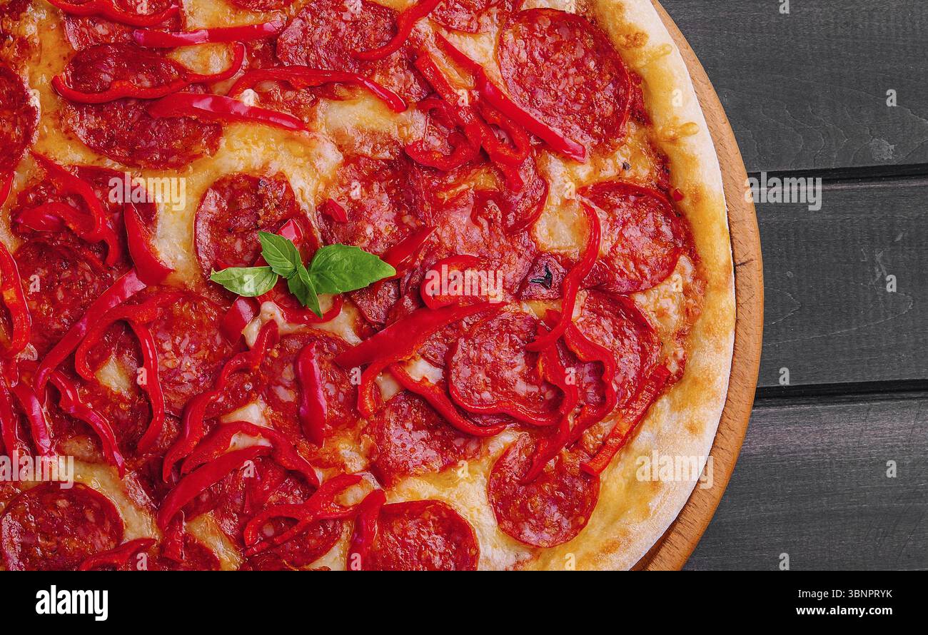 Tasty pepperoni pizza with red bell peper Stock Photo - Alamy