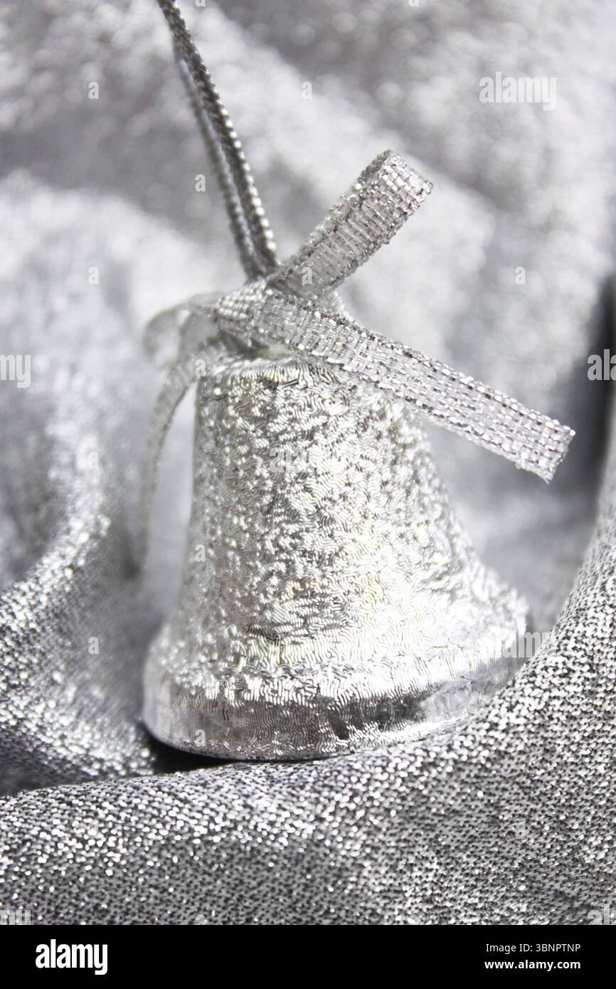 Christmas silver bell on Christmas background Stock Photo - Alamy