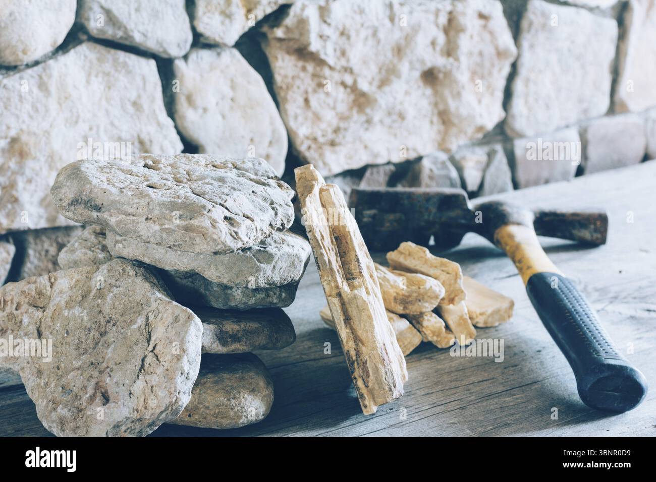 Construction Hammer And Stack Flagstone Against The Wall Of Stone ...