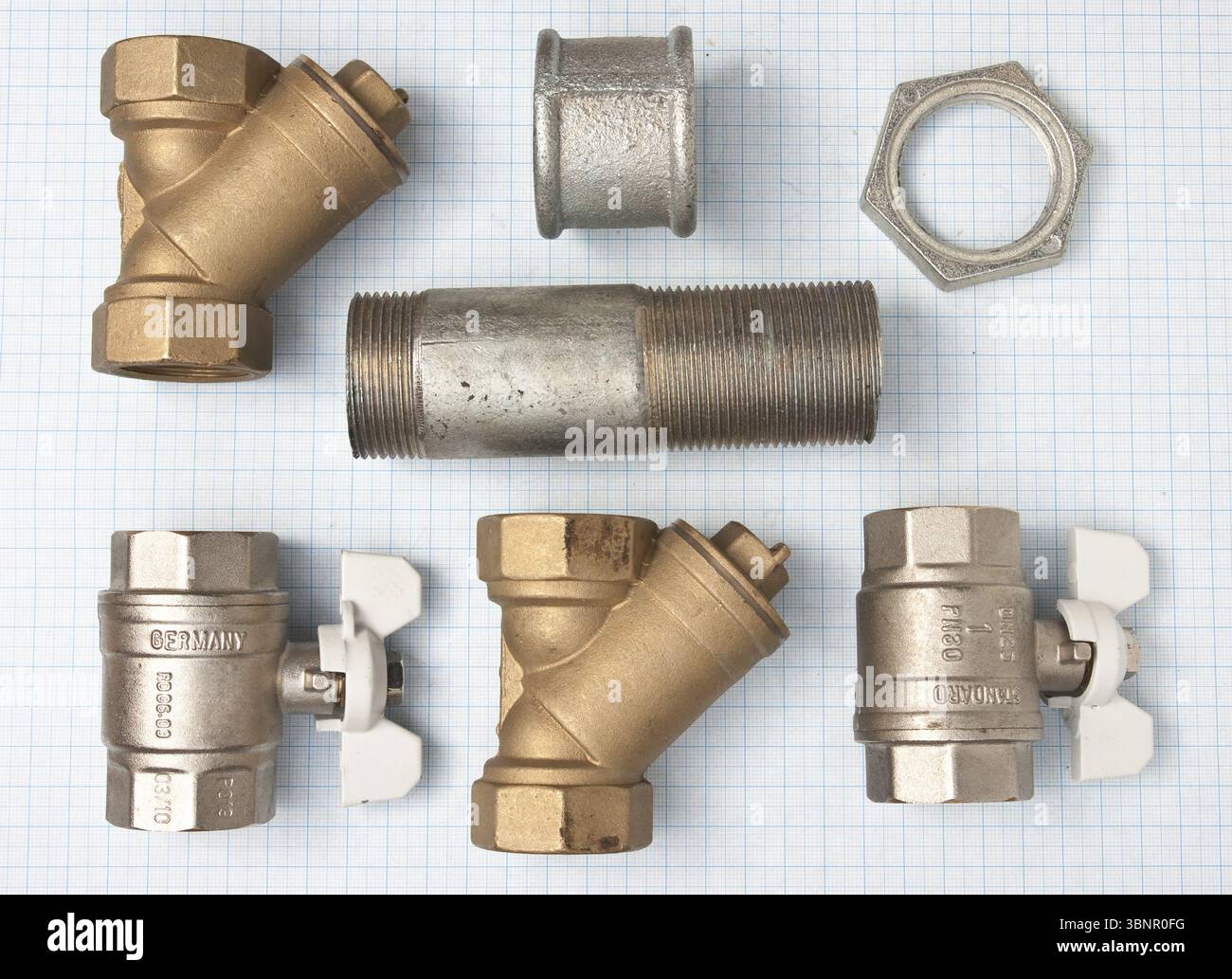 Water inlet valve on a background of graph paper Stock Photo - Alamy