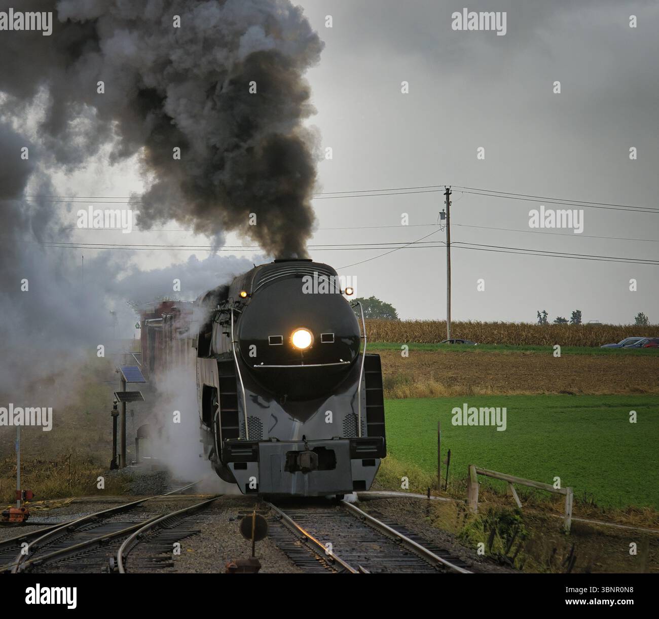 An Antique Restored Steam Freight Train Approaching Head on Blowing ...
