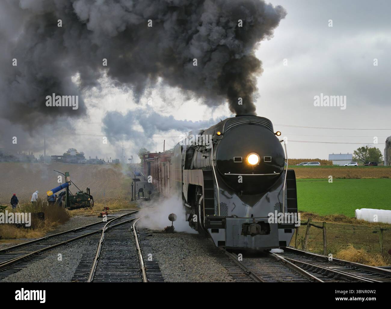 An Antique Restored Steam Freight Train Approaching Head on Blowing ...