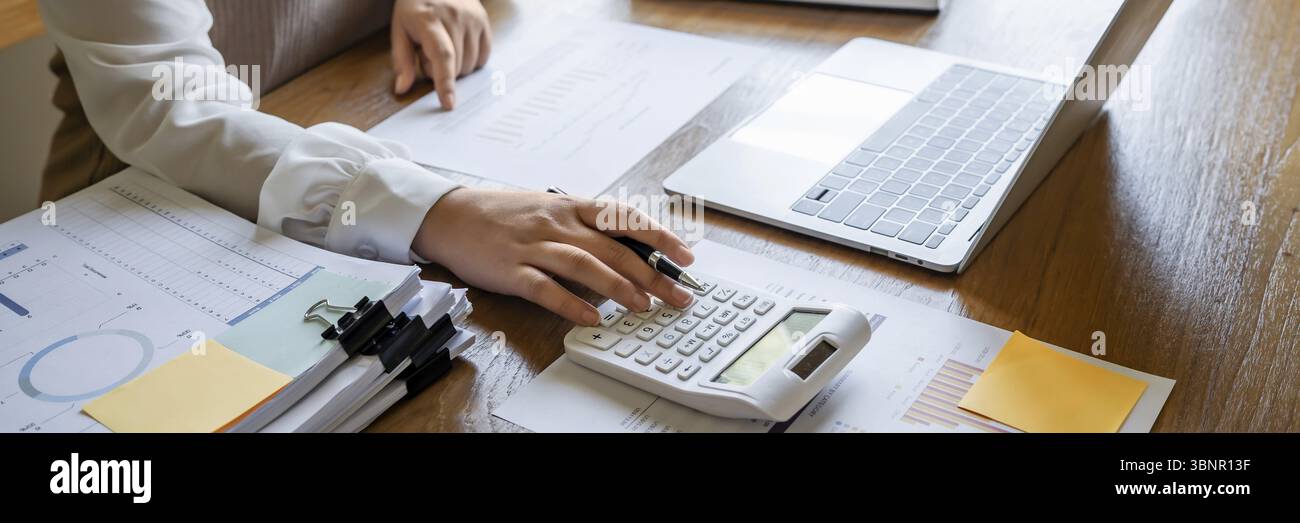 Asian female audit accountant calculating invoice and tax, Financial ...
