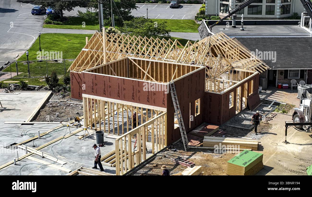 Workers actively building residential structure hi-res stock ...