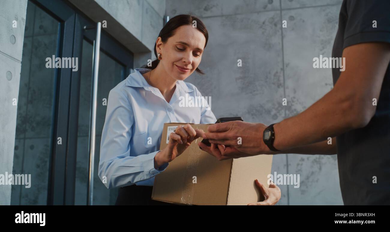 Postman coming modern office building hi-res stock photography and images - Alamy