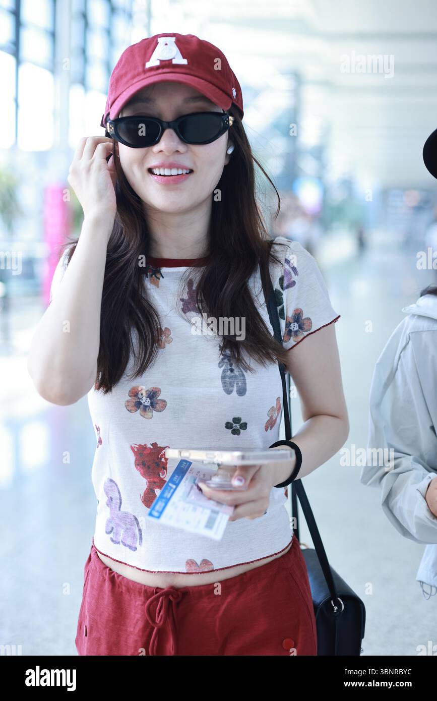 Chinese actress and singer Li Xiaolu appears at airport in Shanghai ...