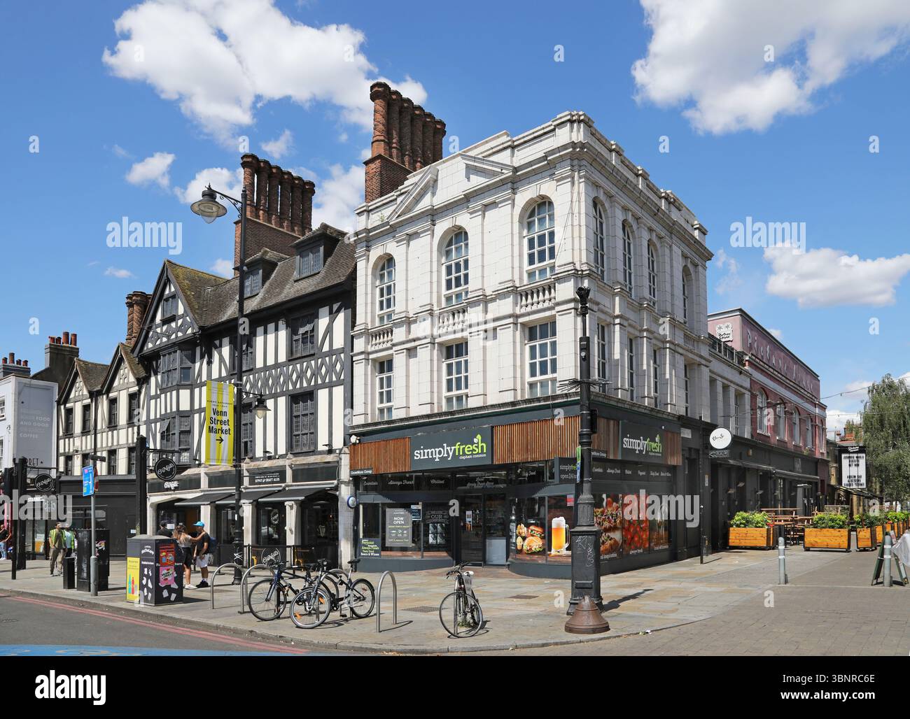 Bars, shops and restaurants on Clapham High Street, London, UK. A busy ...