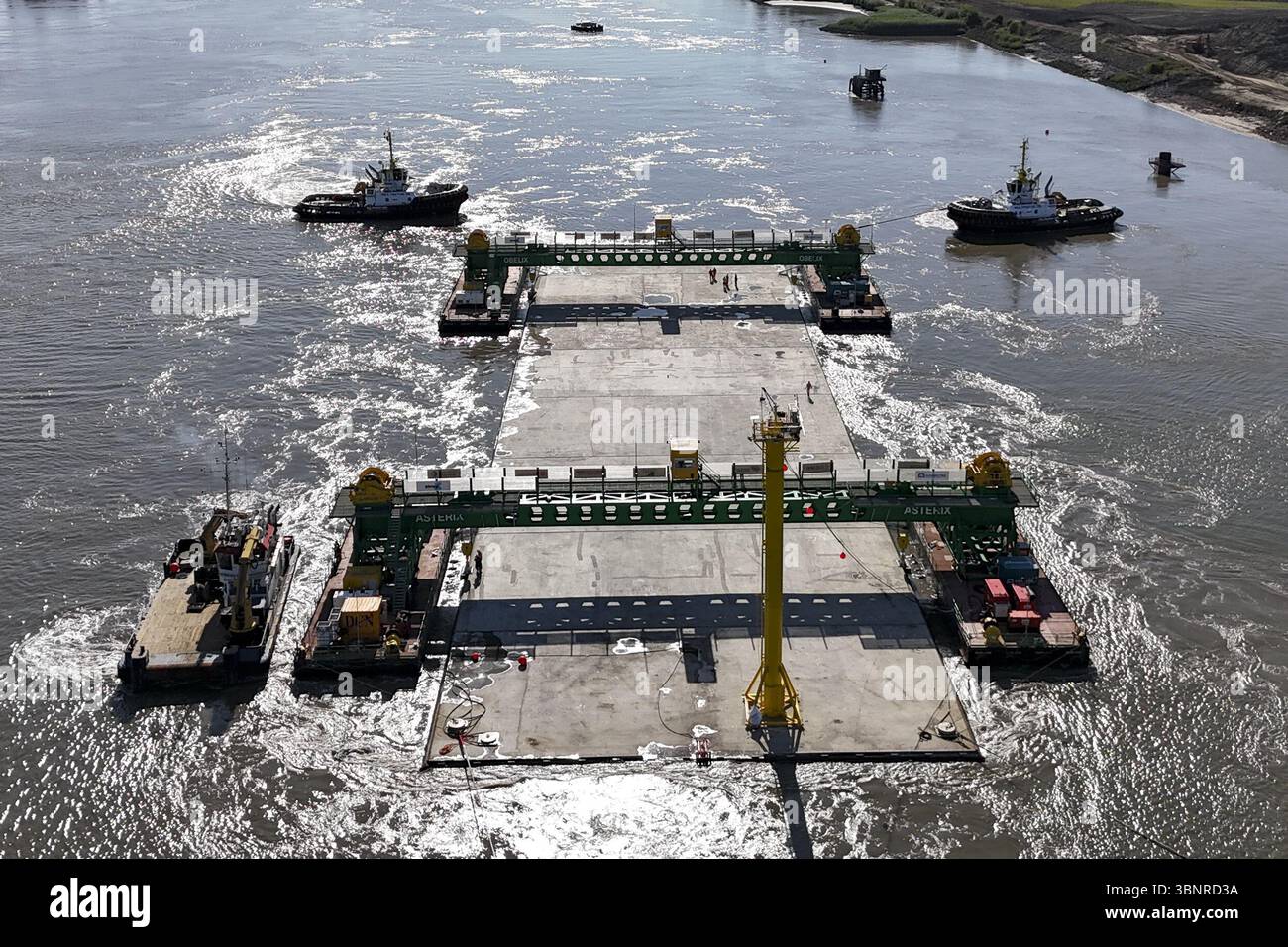 This aerial drone image shows the sinking of the first of eight tunnel ...