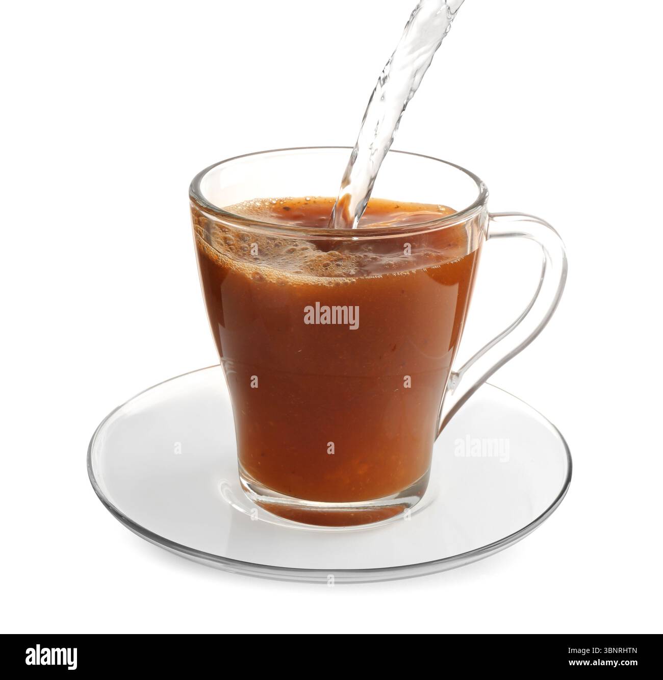 Pouring hot water into cup with instant coffee isolated on white Stock ...