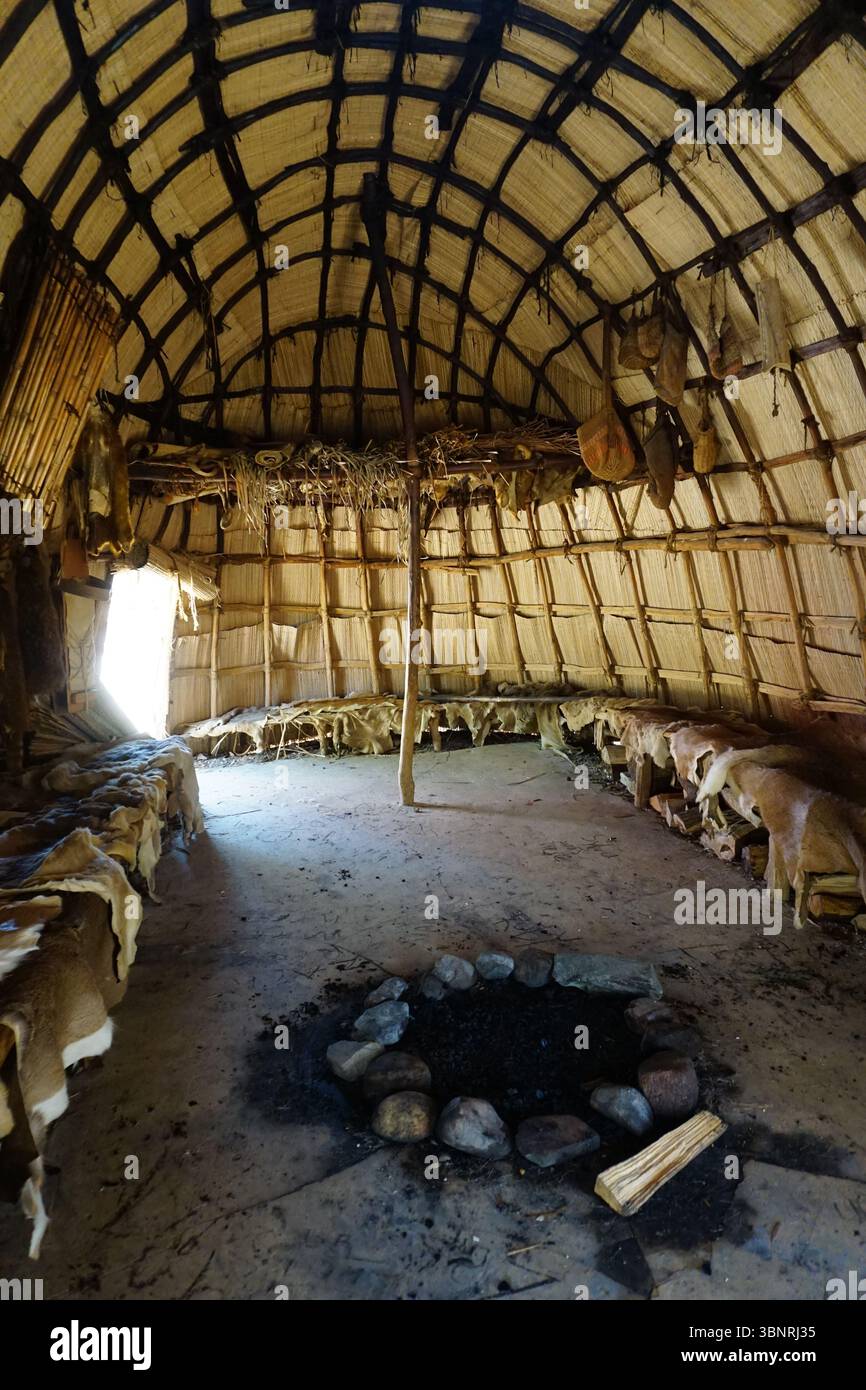 Vertical interior of a traditional Native American hut or tent with a ...