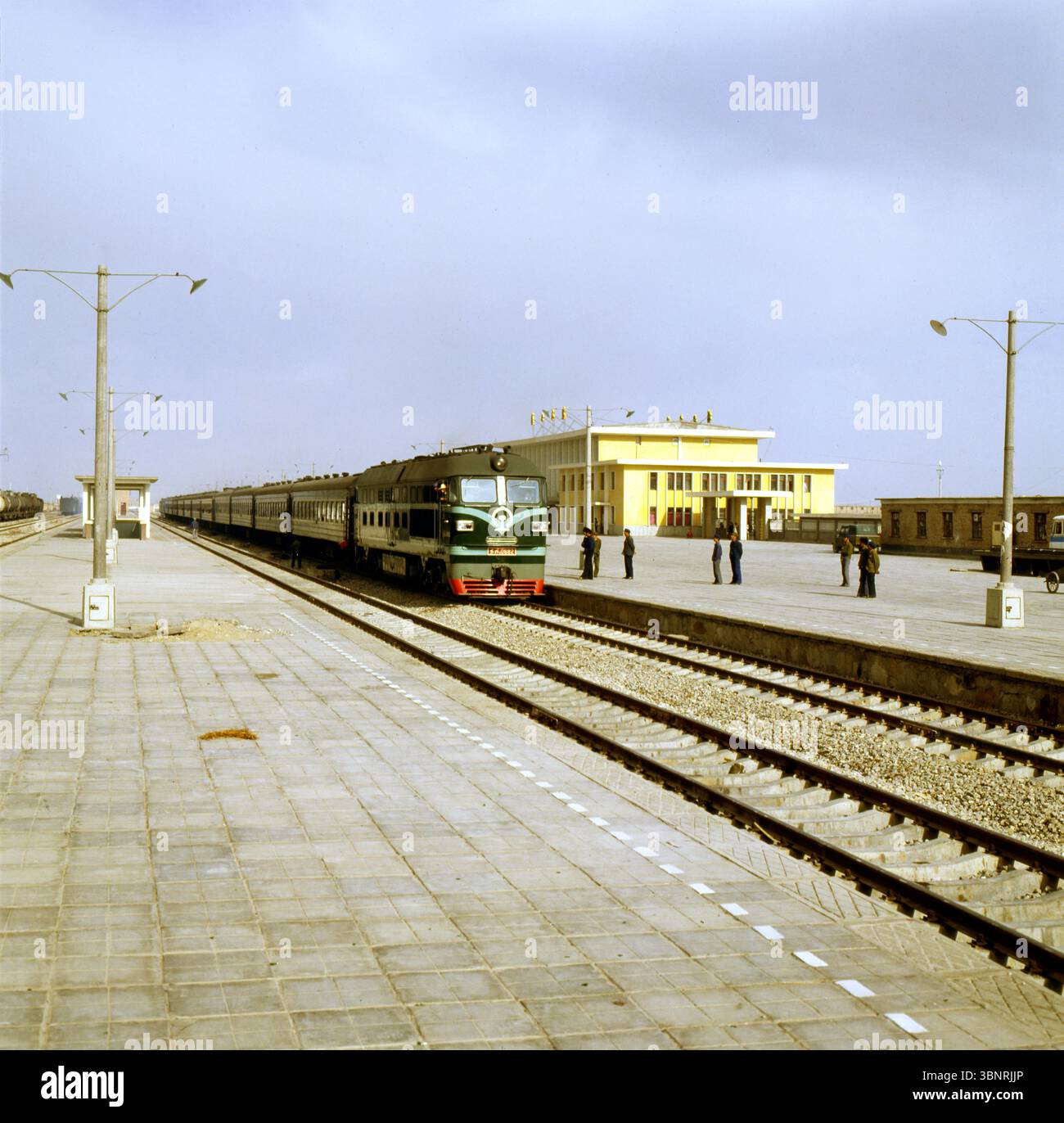 Passenger Train Arriving at Remote Chinese Railway Station, 1980s Stock ...