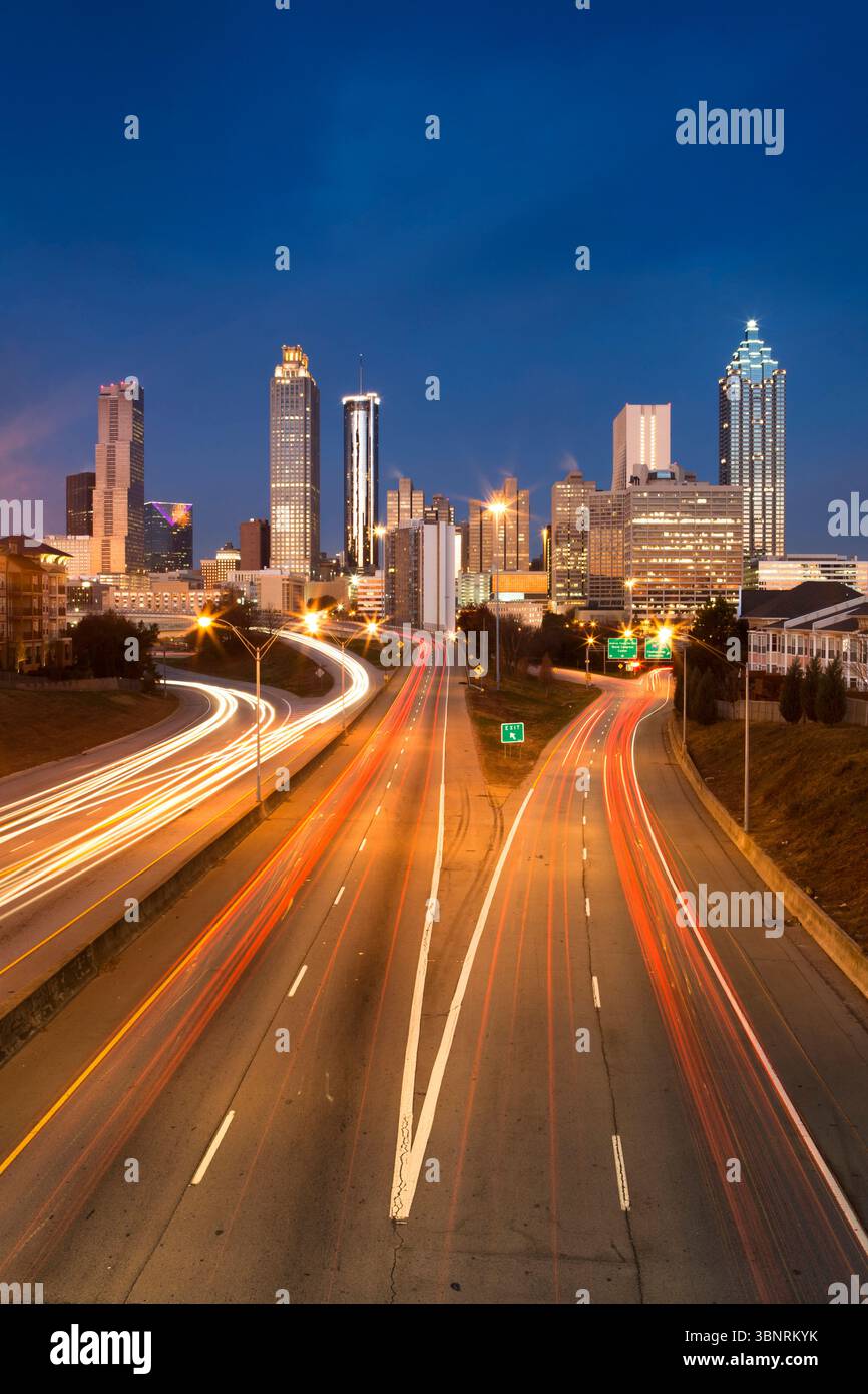 Atlanta city office buildings and highway traffic motion blur across ...