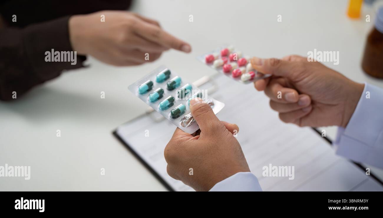 Patient Consultation and Medication Discussion. Doctor explaining ...