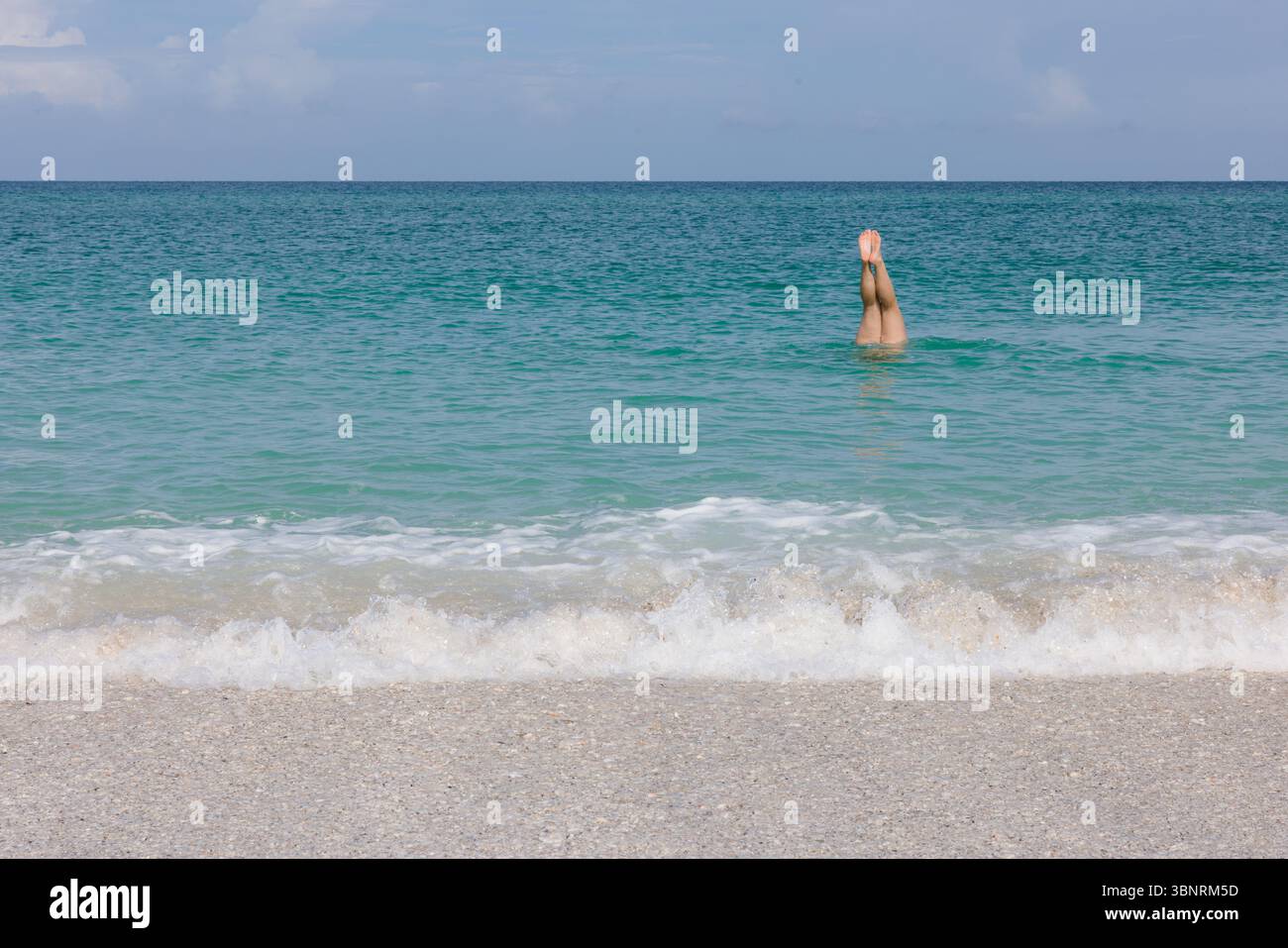 Playful Swim Pose in Ocean at Beach Summer negative space left Stock ...
