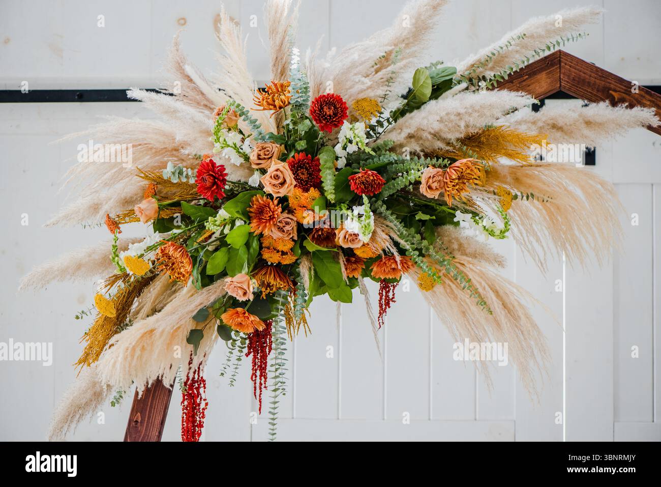 Rustic Fall Wedding Floral Arch Stock Photo - Alamy