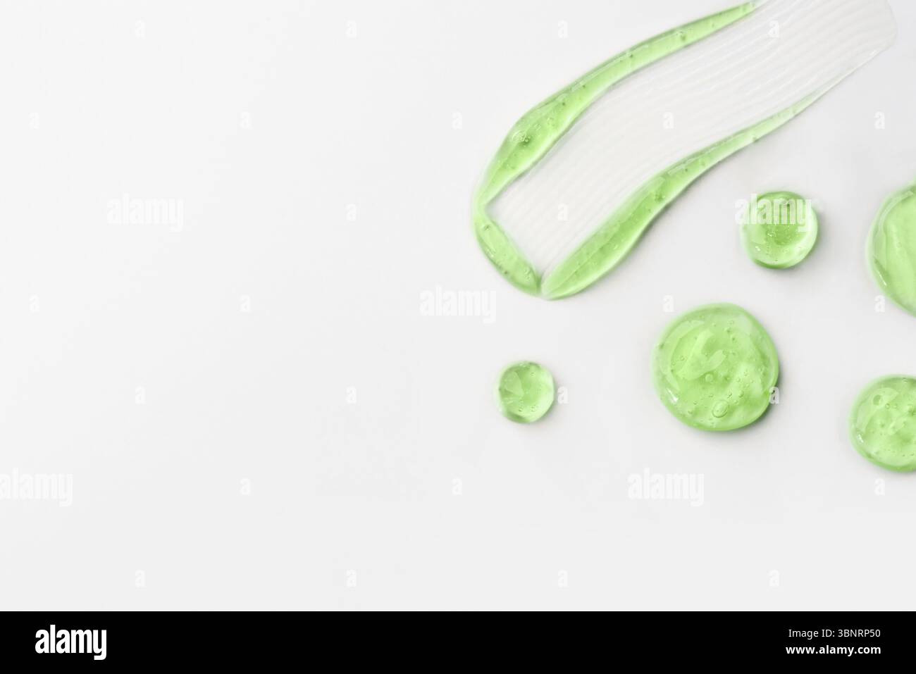 Cosmetic gel drops on a white background Stock Photo - Alamy