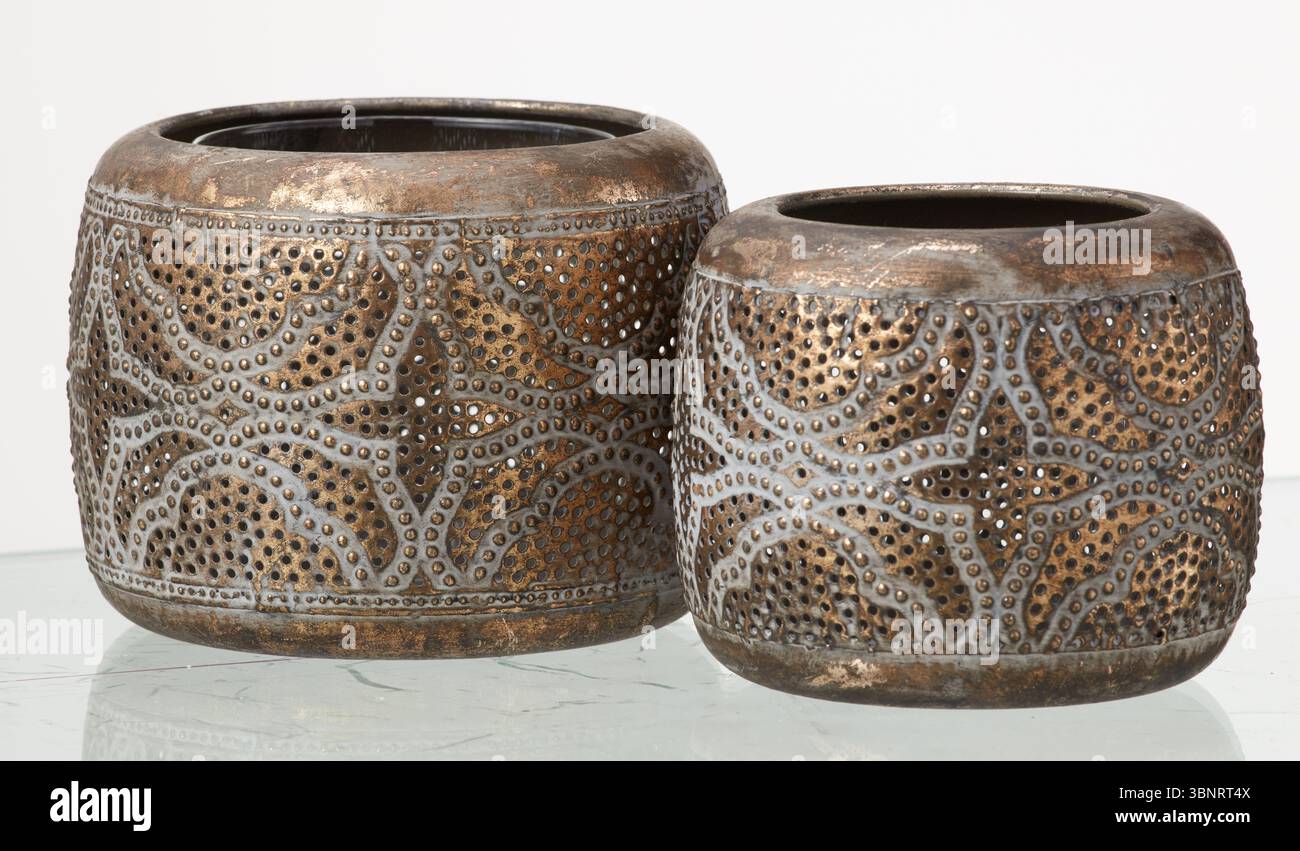 Antique copper perforated metal pair jars isolated nature background ...
