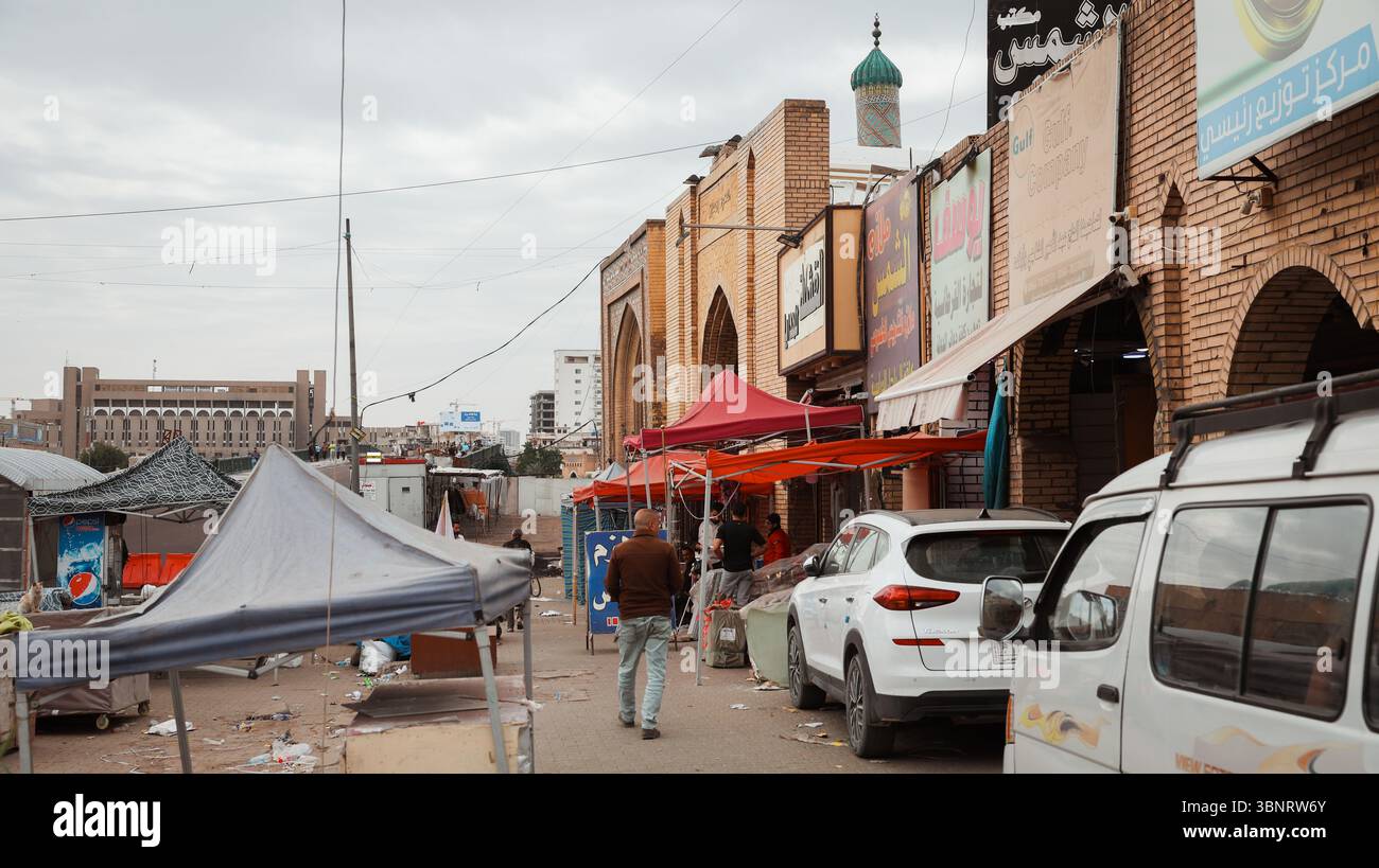 Local vendors set up colorful stalls in a bustling market in Baghdad ...