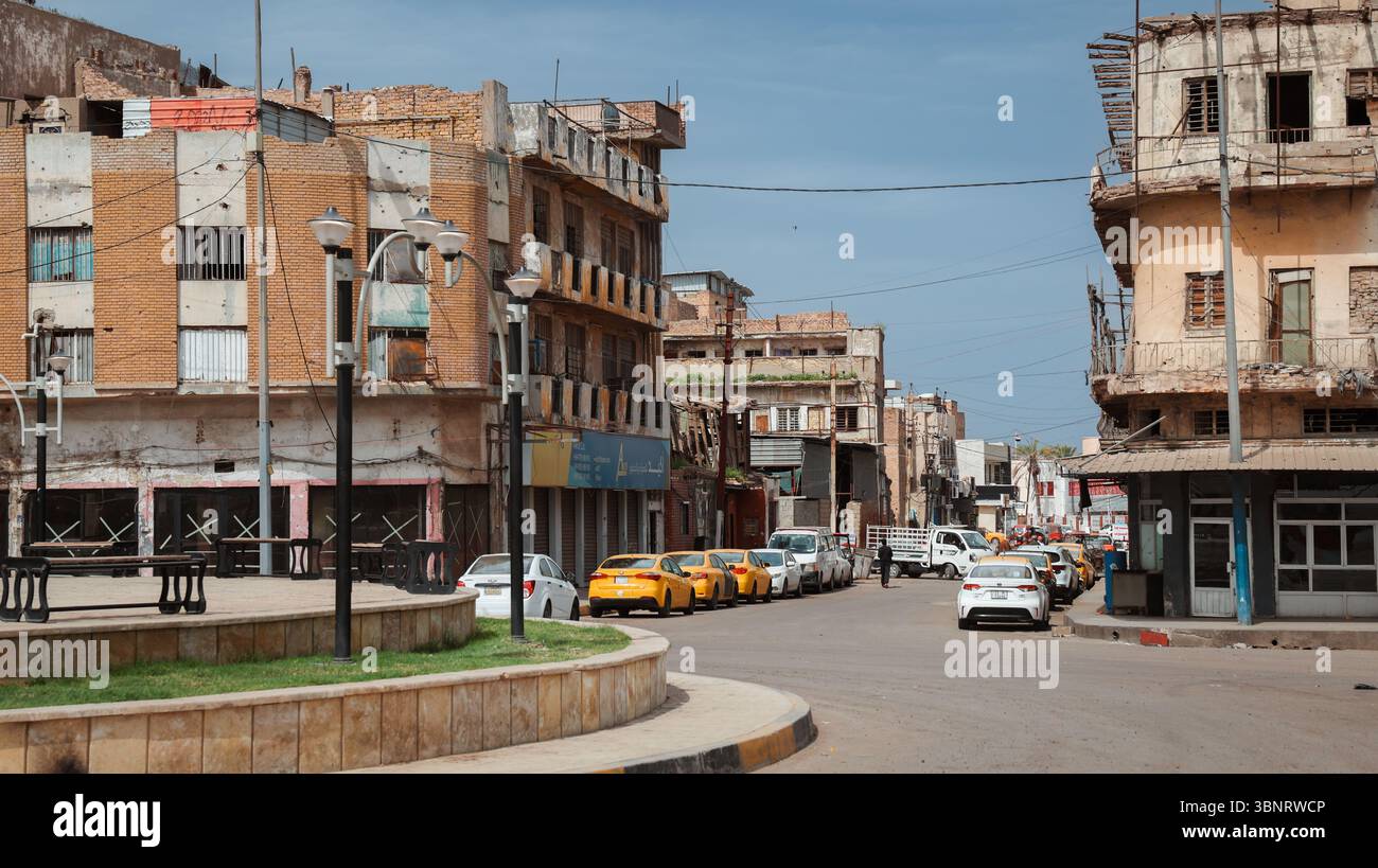 Street in Baghdad, Iraq, displays a mix of urban architecture with ...