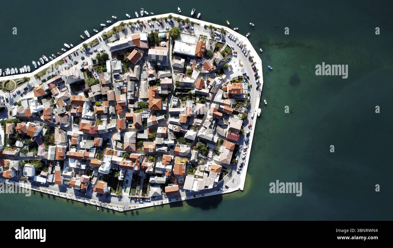 Aerial view of terracotta roofs and clustered buildings meet the ...