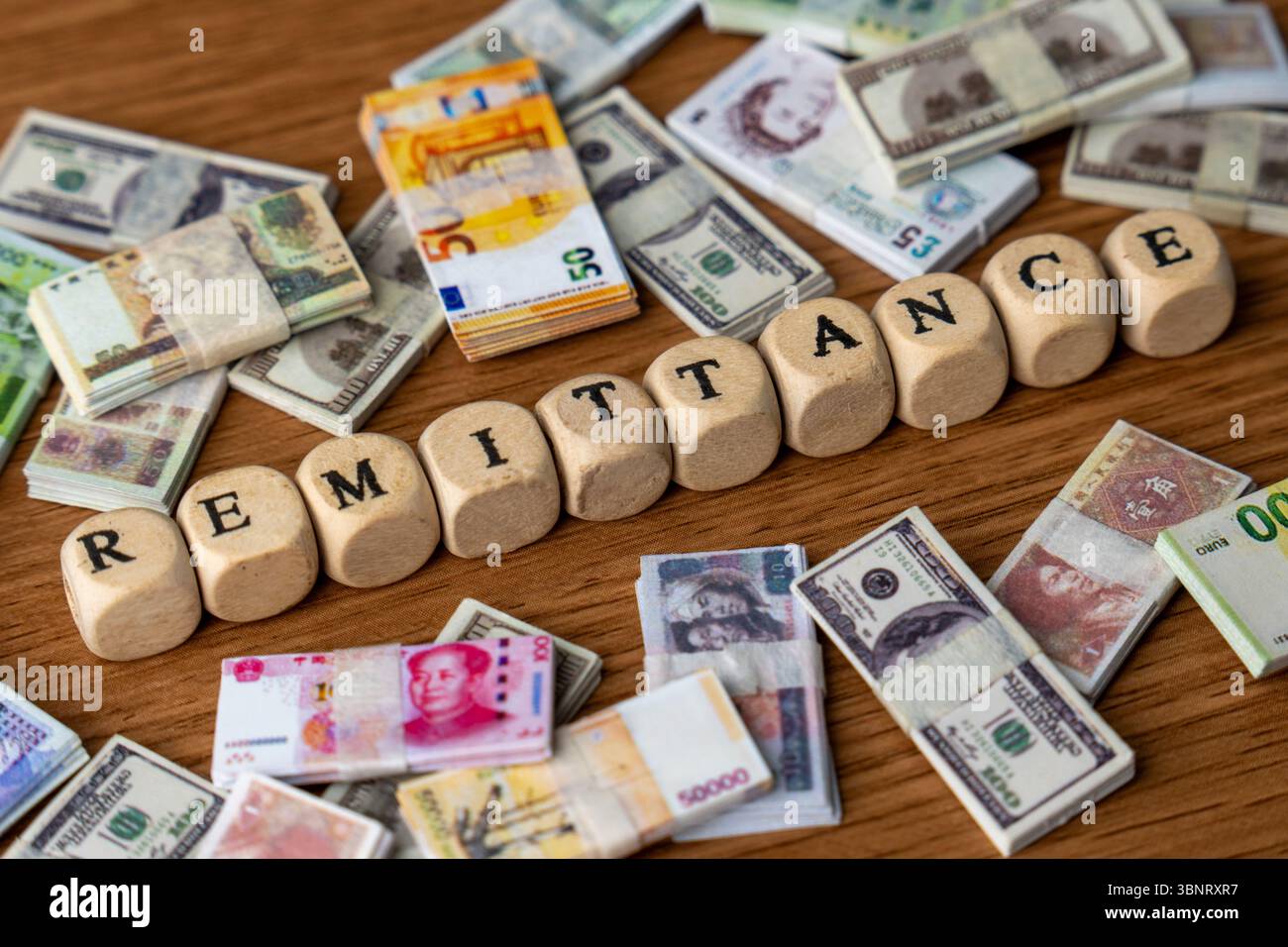 The word "REMITTANCE" surrounded by a banknotes from various countries ...