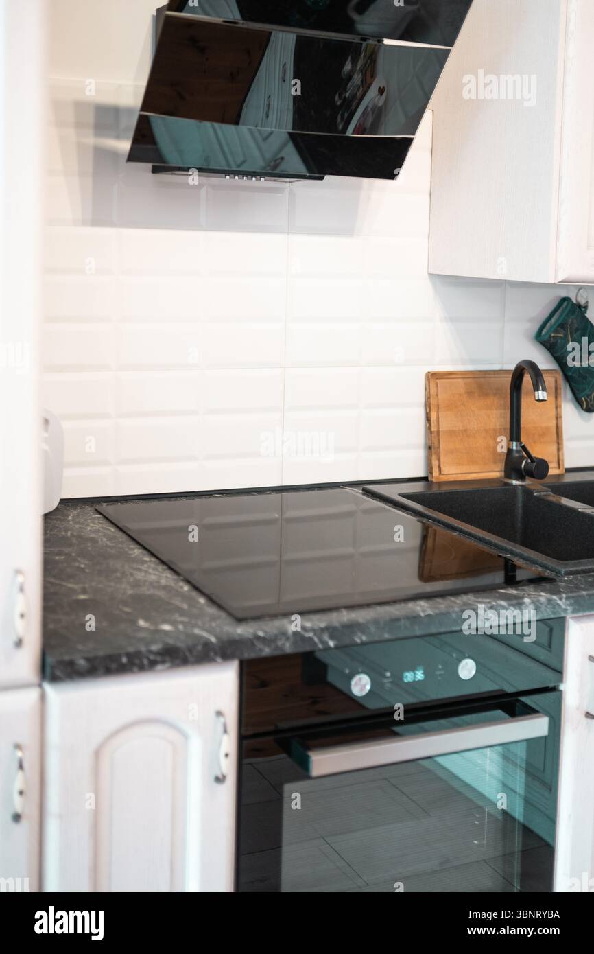 Modern kitchen with an electric stove Stock Photo - Alamy