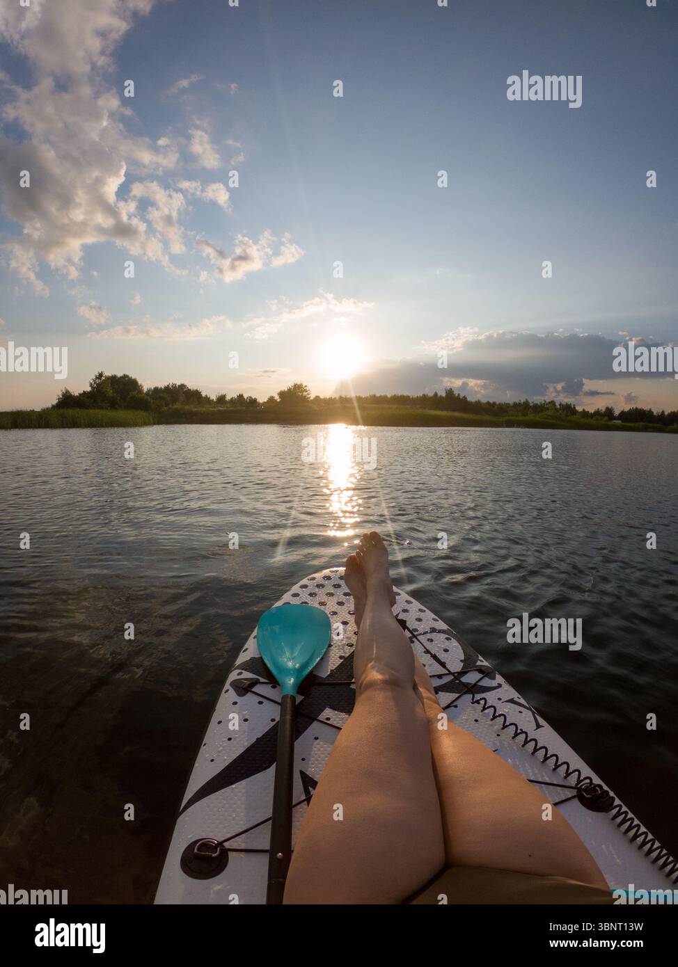 Woman on supboard sunset summer hi-res stock photography and images - Alamy