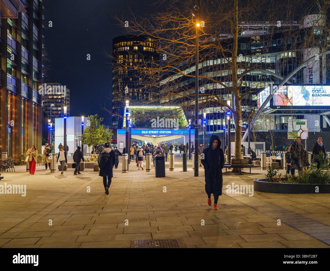 United Kingdom, London, 14 Jul 2025. Evening pedestrians walk through Old Street’s tech district ...