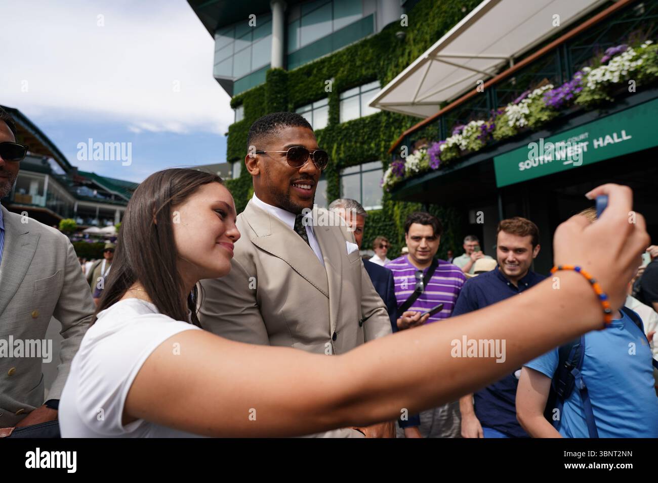 Anthony Joshua posing for a selfie with a fan whilst attending day five ...