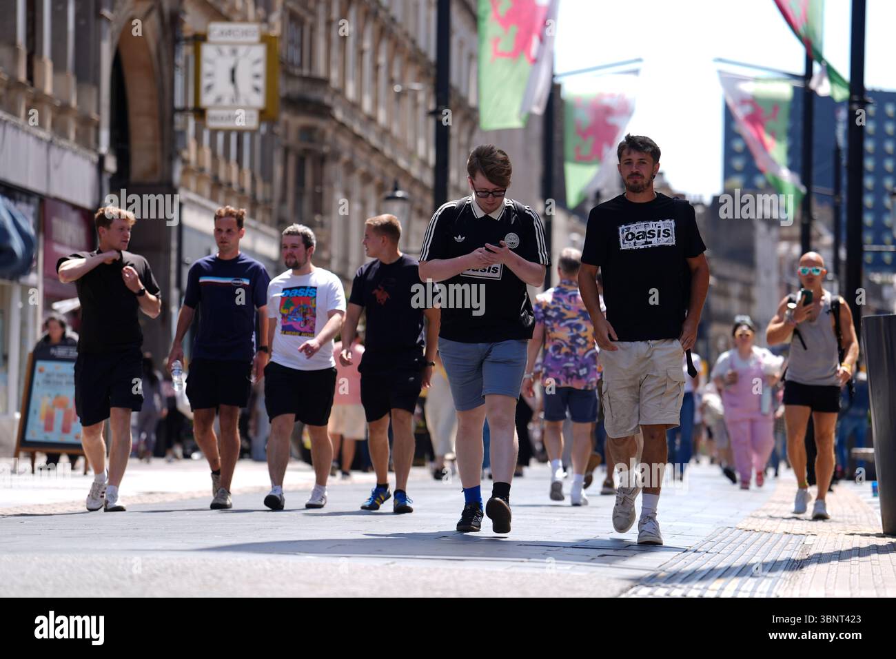 Oasis fans walk through the centre of Cardiff ahead of the first show ...