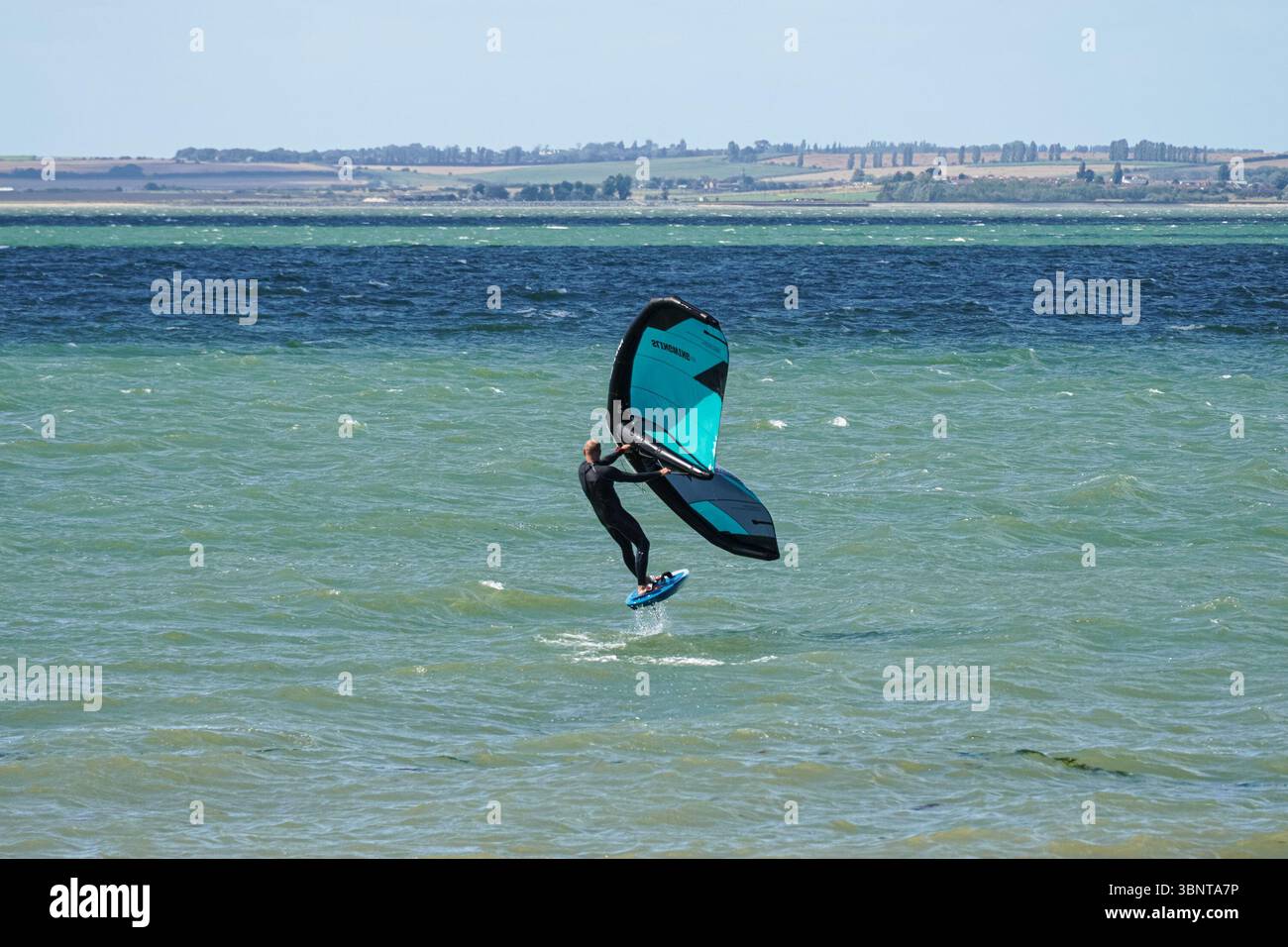 People wing foiling on the sea in Whitstable, Kent, England United ...