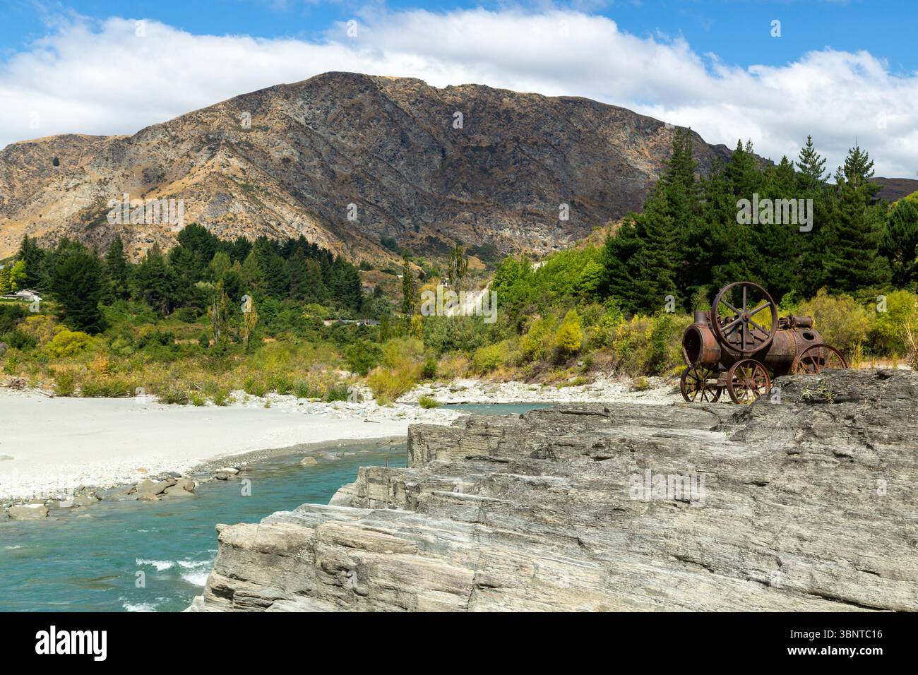 An old Steam engine from the gold rush on the Shotover River near ...