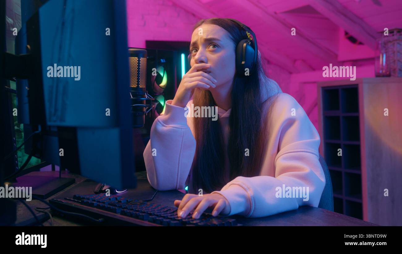 Frustrated sad woman gamer girl female streamer in headphones worry ...