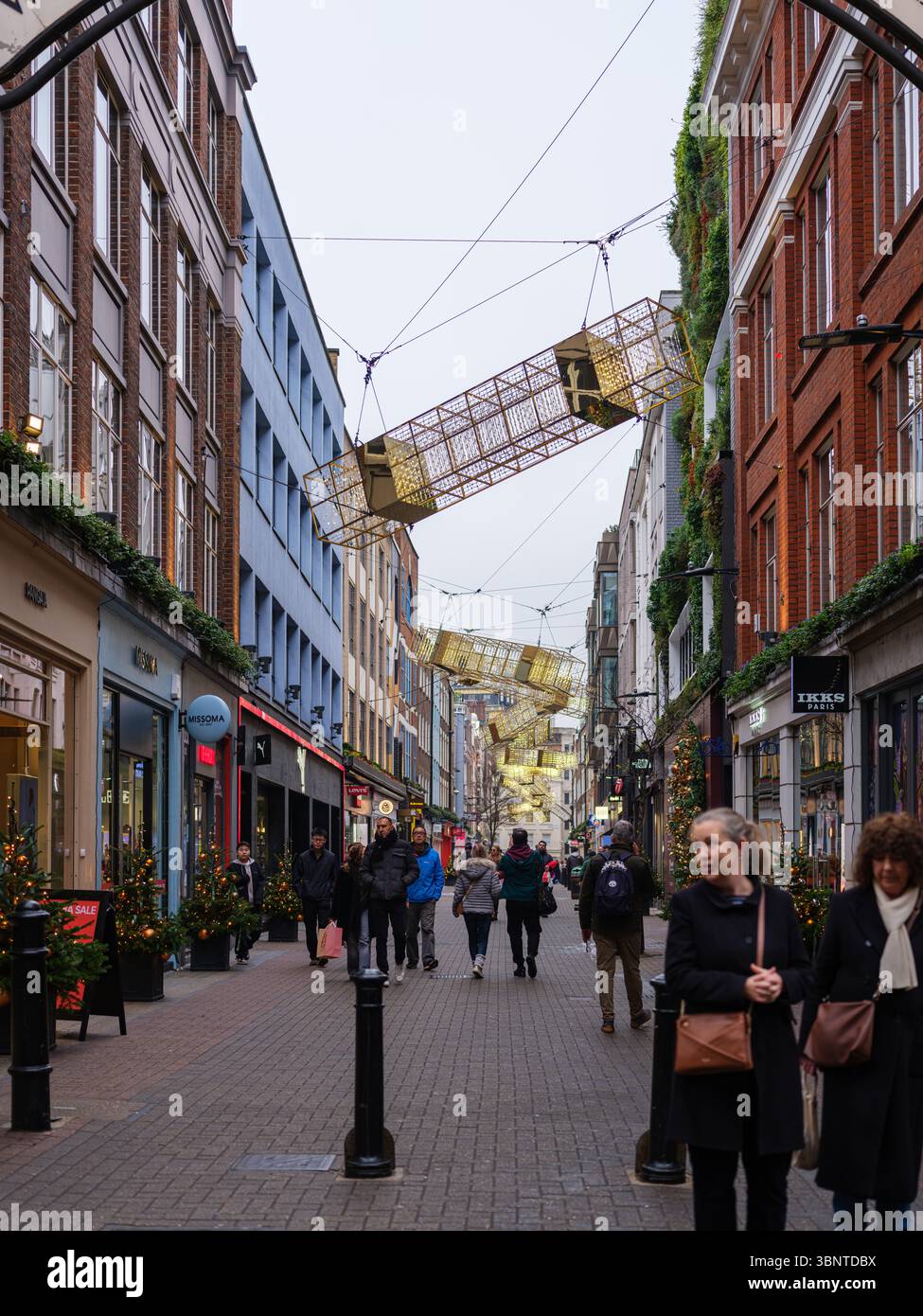 London, UK, 16 Dec 2024. Iconic 'Welcome to Carnaby Street' sign with ...