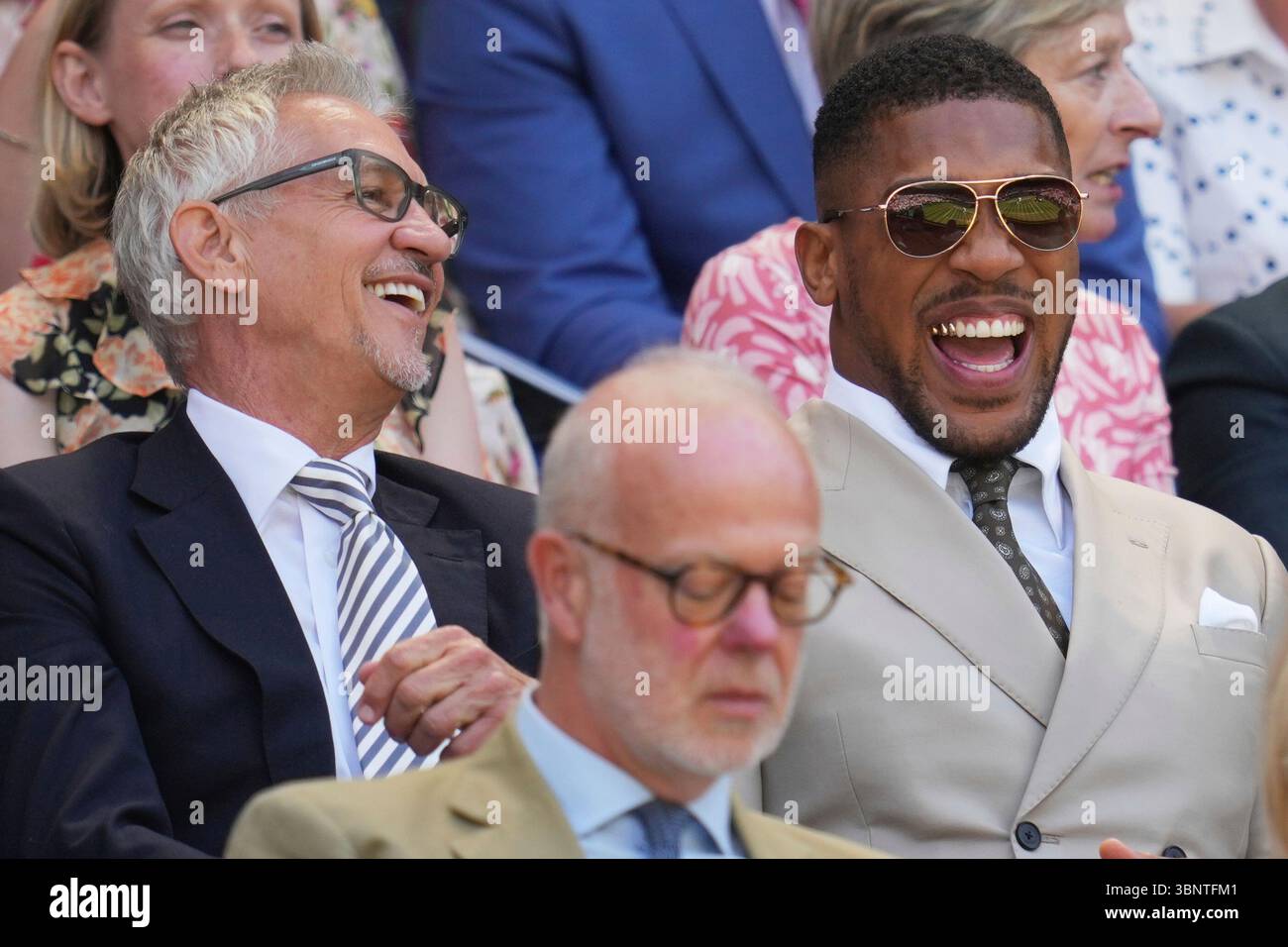 Broadcaster and former soccer player Gary Lineker, left, and boxer ...