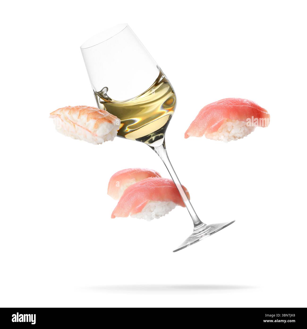 Wine in glass and nigiri sushi falling on white background Stock Photo ...