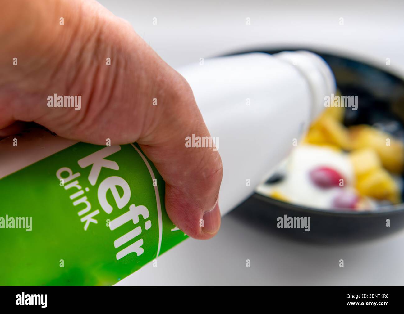 Pouring fresh yogurt from bottle hi-res stock photography and images ...