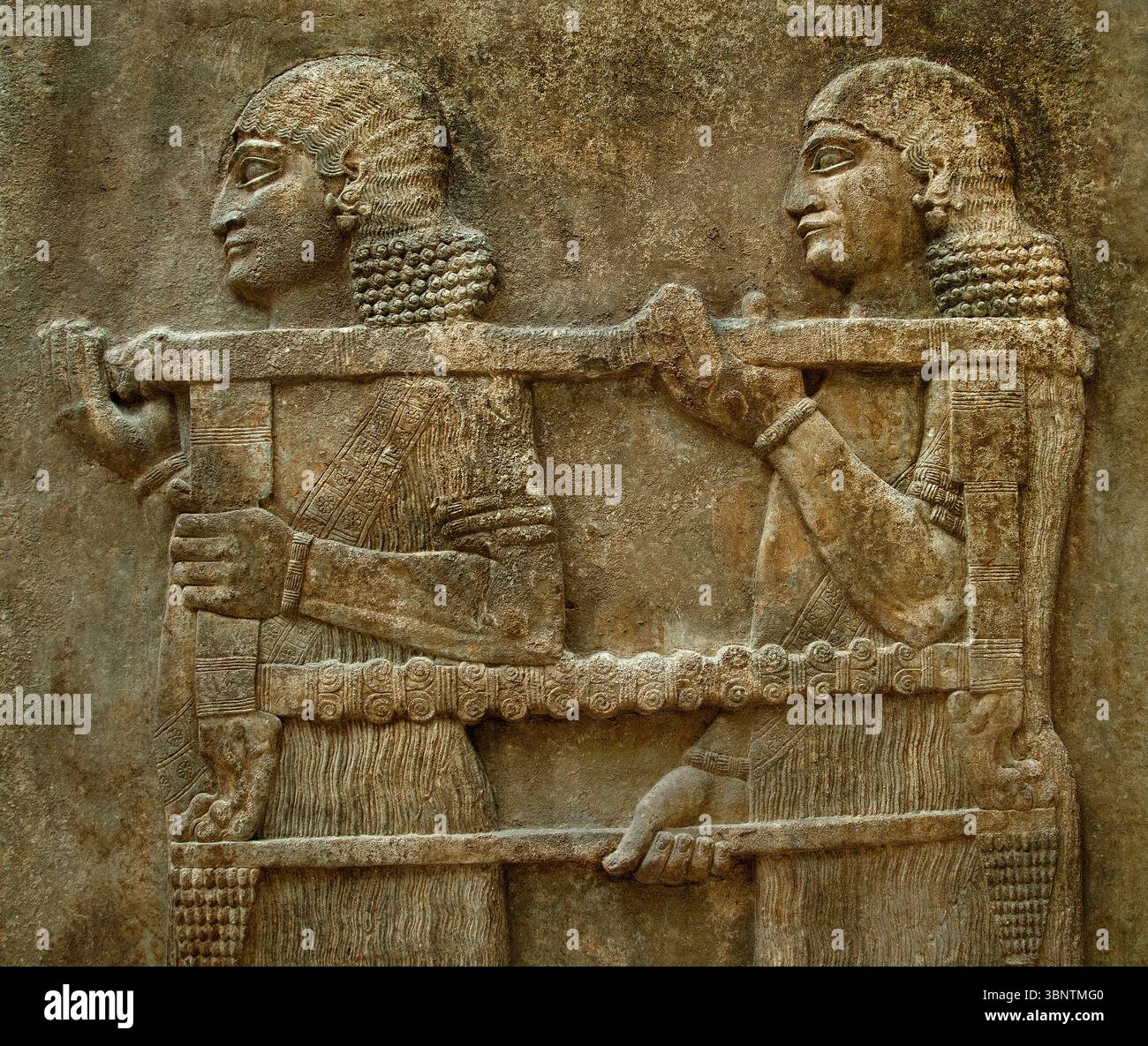 Two servants carrying a chair and a vase Neo Assyrian Sargon II 721-705 ...