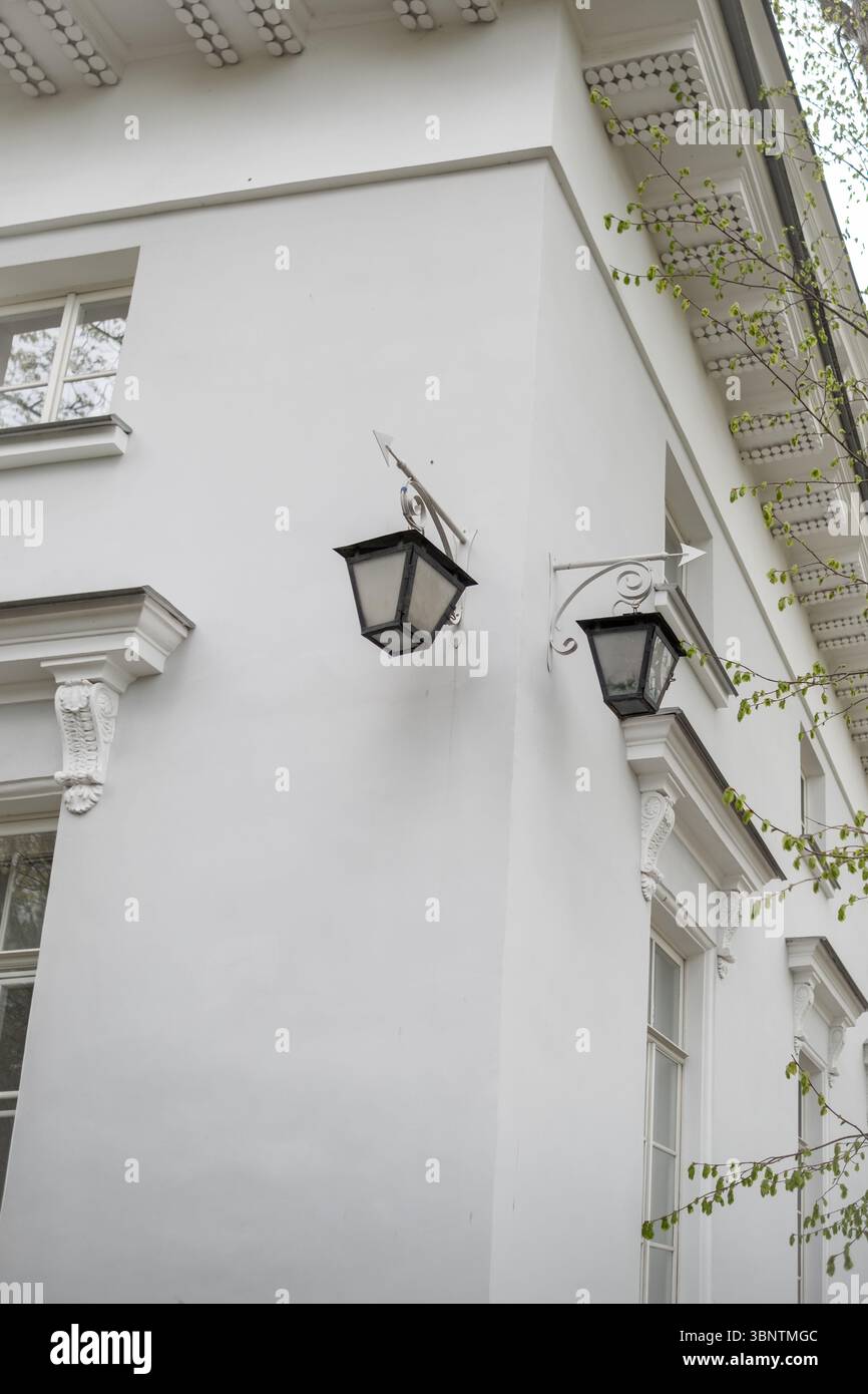 Elegant White Building Showcasing Vintage Lanterns and Classic ...