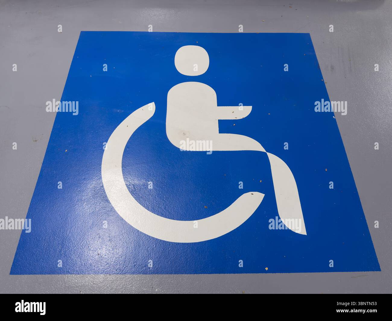 Disabled parking sign with wheelchair icon and assistance message Stock ...