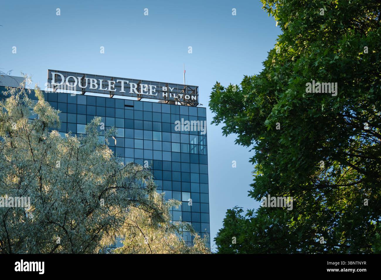 Lodz, Poland – July 2, 2025: DoubleTree by Hilton hotel sign on a ...