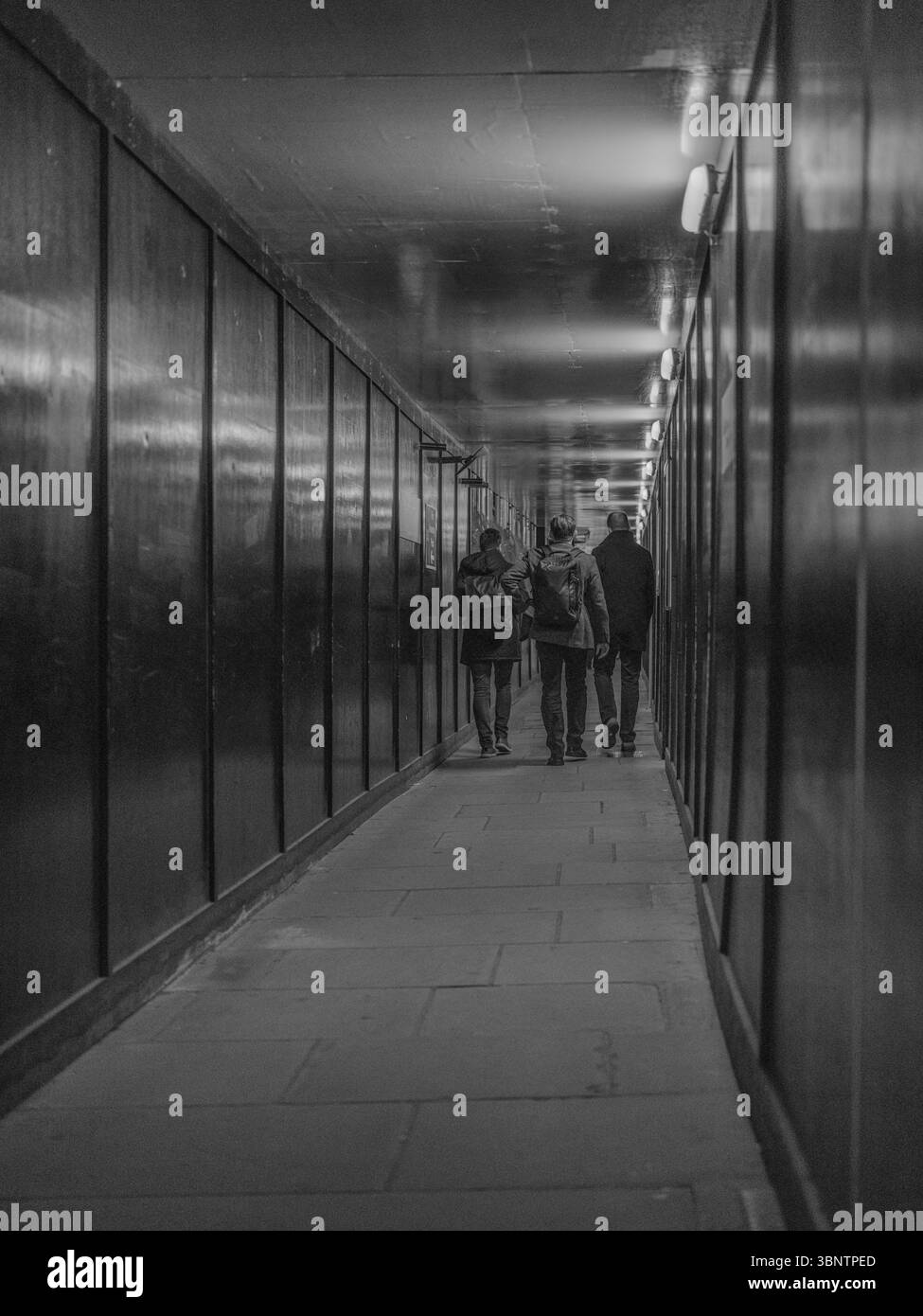 United Kingdom, London, 11 Dec 2024. People walk through a dimly lit ...