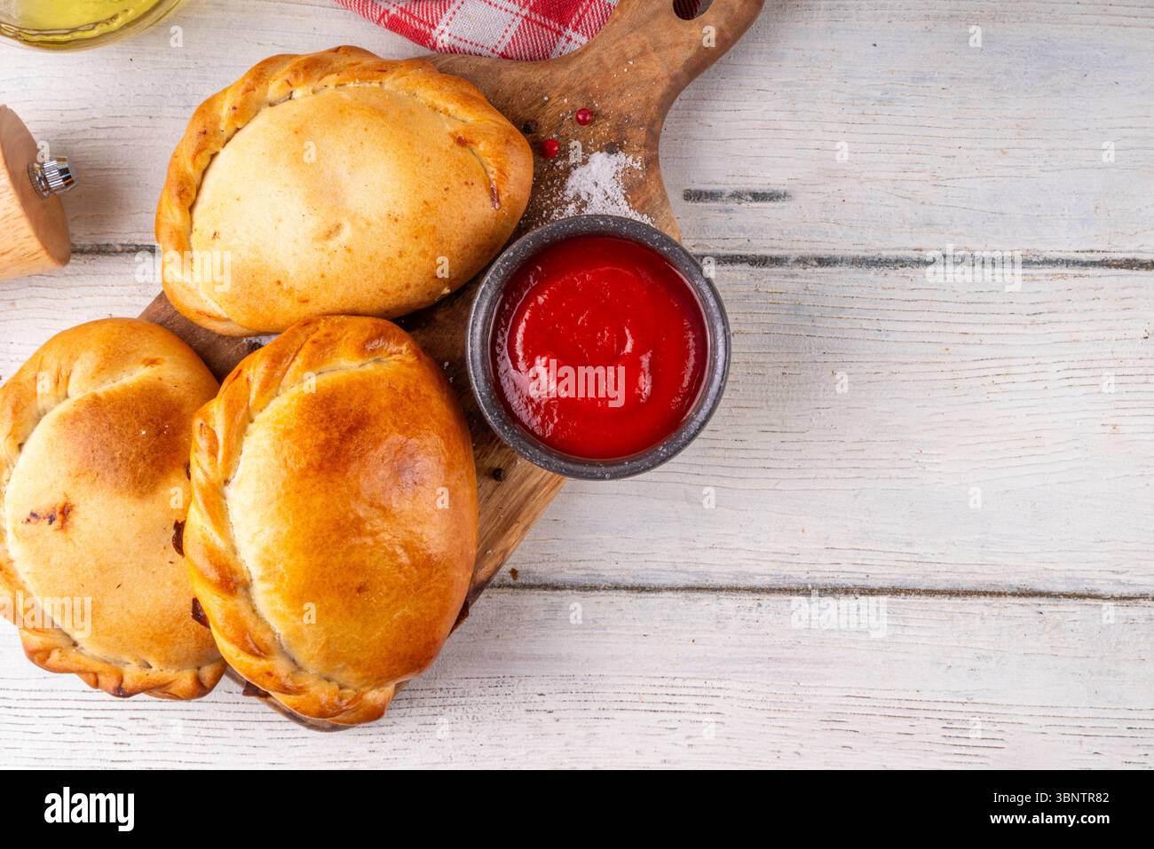 Homemade golden baked hand pies, with filling. Italian closed pizza ...