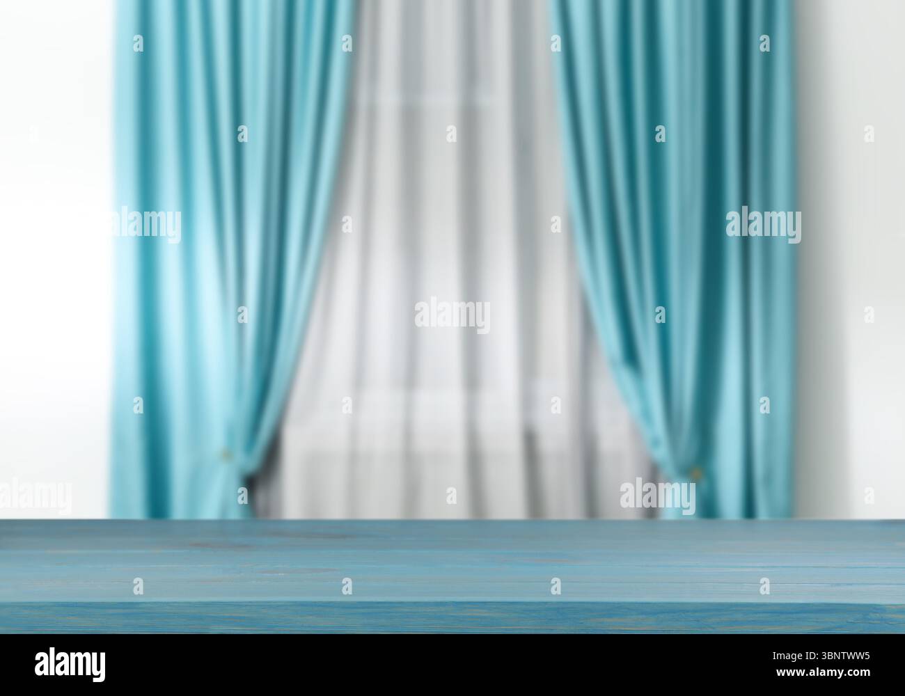Empty wooden table against window with curtains in room Stock Photo - Alamy