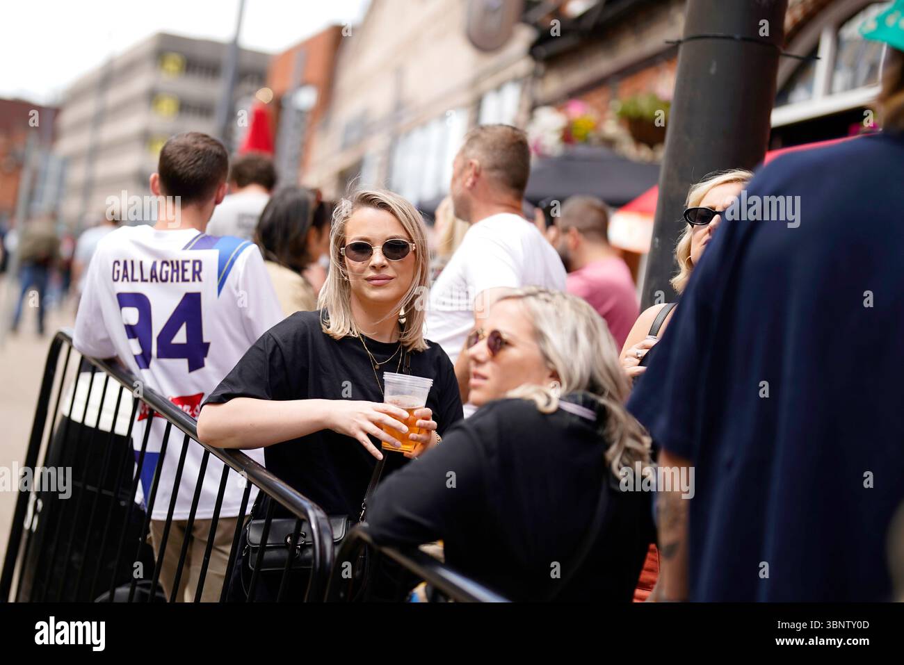 Oasis fans enjoying a drink in the Cardiff sunshine, ahead of the first ...