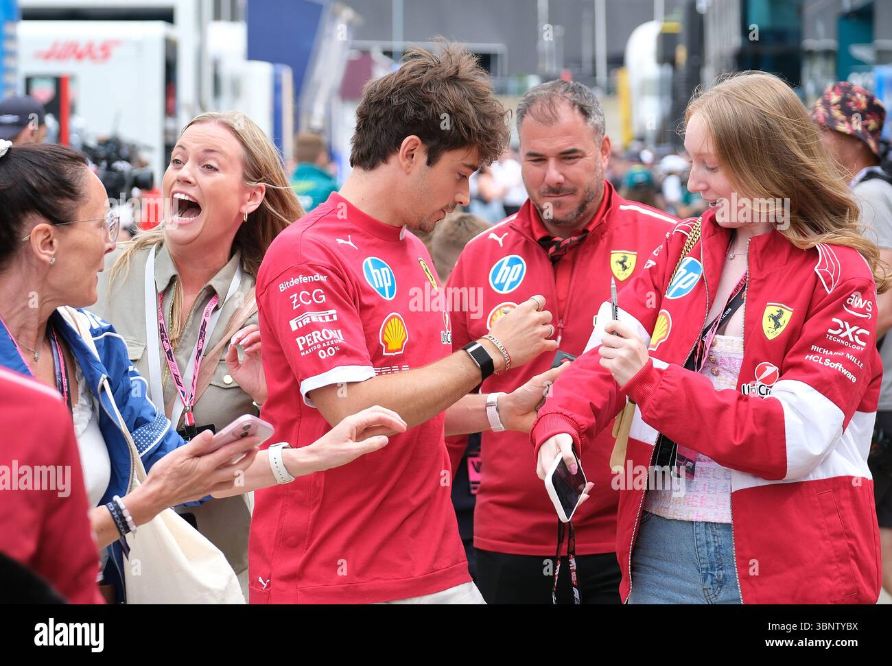 Charles Leclerc of Scuderia Ferrari F1 Team signs autographs for fans ...